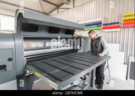 Office table of electrical engineer with installation project and tools ...