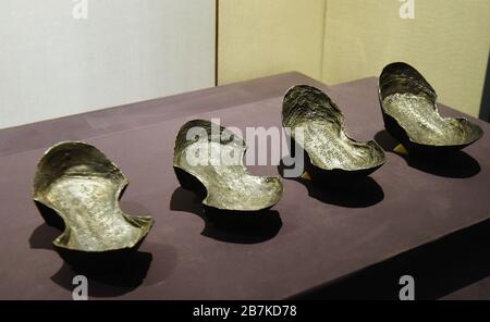 Ancient Chinese silver ingots or sycees of Ming Dynasty are on display ...