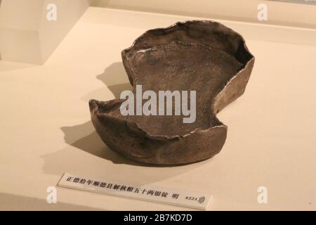 An ancient Chinese silver ingot of Ming Dynasty is on display at the ...