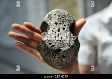 An ancient Chinese silver ingot or sycee of Ming Dynasty is on display ...