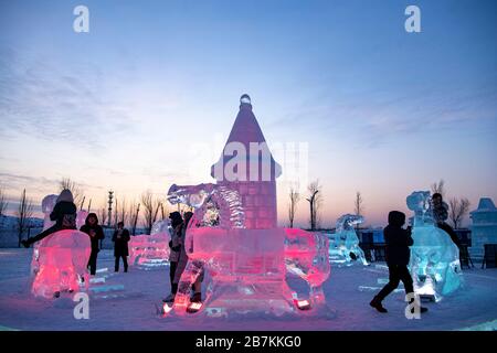 Visitors enjoy various ice and snow activities at Hanggang Park in ...