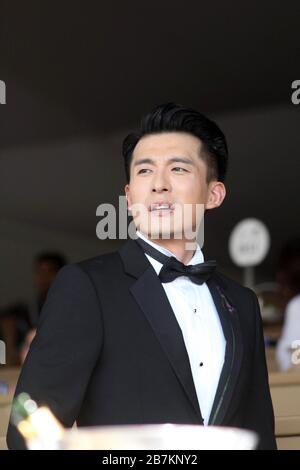 --FILE--Chinese actor Sun Yizhou, also known as Sean Sun, shows off ...