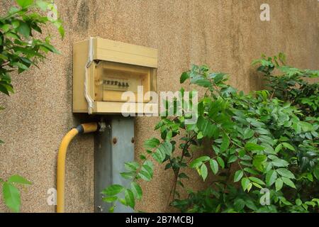 Switchboard connected to electrical pipe installed on the wall full of ...
