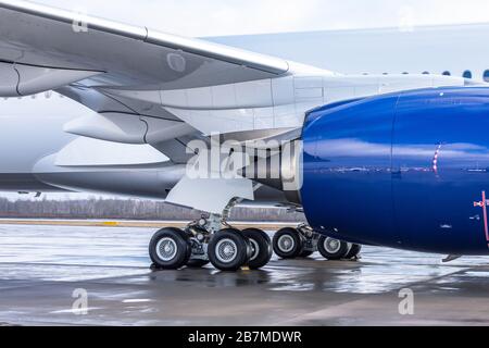 Jet engine under the wing of a modern passenger aircraft at an ...