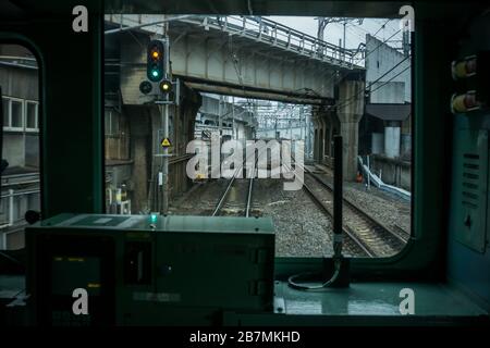 Driver in cab on JR Japan Railways Narita Express train Tokyo Japan ...