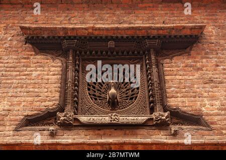 The Wood Carved Peacock Window in Bhaktapur, Nepal Stock Photo - Alamy