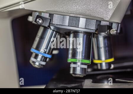 Nosepiece of a microscope with objectives Stock Photo - Alamy