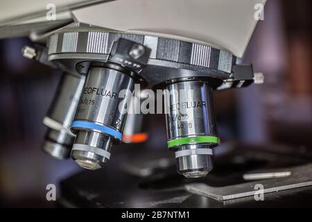 Nosepiece of a microscope with objectives Stock Photo - Alamy