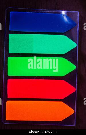 Arrows with fluorescent paint in UV light Stock Photo - Alamy