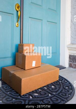 Cardboard box delivered to front door Stock Photo - Alamy