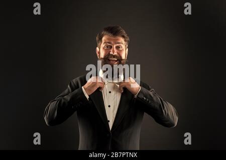Classic and fashionable. Happy groom fix fashionable bow tie. Bearded ...