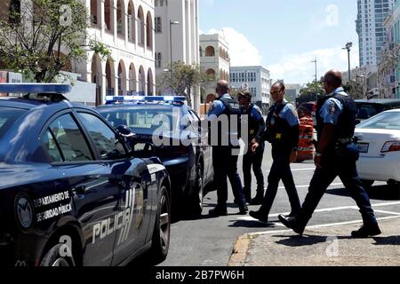 Police in Puerto Rico San Juan with cell phones and guns and uniforms ...