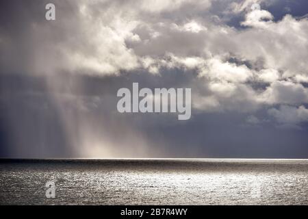 Squally rain shower at sea Stock Photo - Alamy