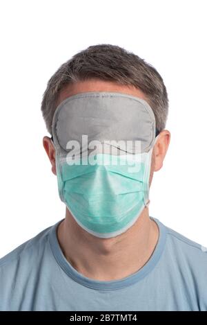 Sleep mask on green background Stock Photo - Alamy