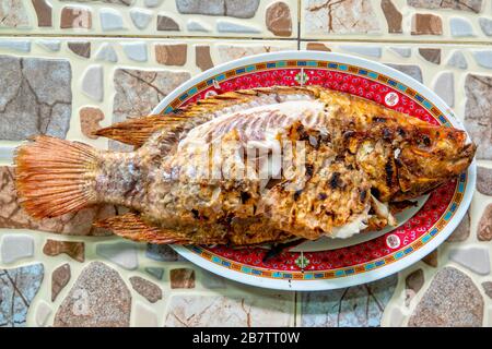 Pla Pao, Thai salt grilled fish Stock Photo - Alamy