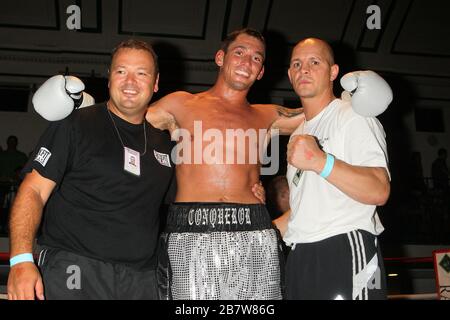 Tony Conquest (silver shorts) defeats Hastings Rasani (camouflage ...