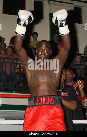 Erick Ochieng (red shorts) defeats Alex Spitko in a Middleweight boxing ...