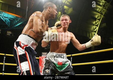 Young Mutley (dark blue shorts) defeats Barrie Jones in the Quarter ...