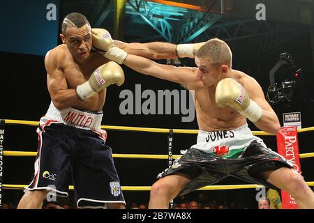 Young Mutley (dark blue shorts) defeats Barrie Jones in the Quarter ...