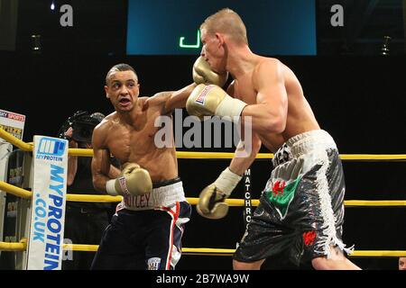 Young Mutley (dark blue shorts) defeats Barrie Jones in the Quarter ...