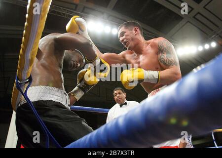 Tony Conquest (white shorts) defeats Toks Owoh in a Cruiserweight ...