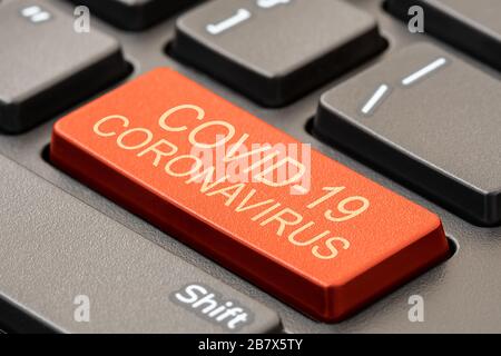 Corona Virus keyboard with a single large red key on a black computer ...