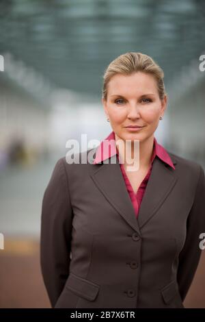 Adult professional woman standing in bicycle shop Stock Photo - Alamy
