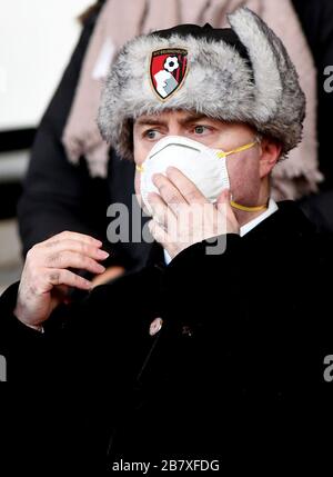 A fan is seen wearing a face mask before the FA Cup match at Stamford ...