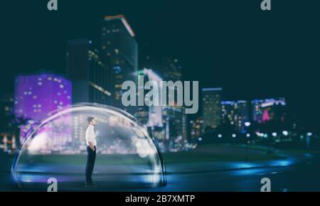 Businessman safely inside a shield dome in the city at night ...