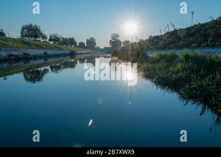 A view of the Bega river early in the morning. Sunrise in the city ...
