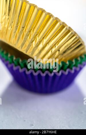 Colorful foil baking cupcake liners in cupcake pan Stock Photo - Alamy