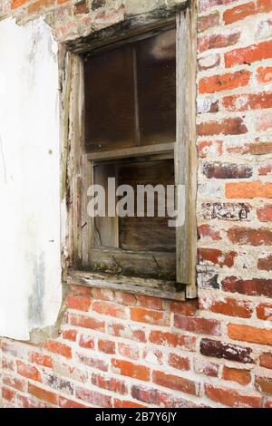 An old window in a decaying brick wall Stock Photo - Alamy
