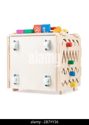 Baby toy on chair, door background Stock Photo - Alamy