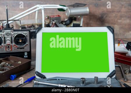 a tablet with green screen and RC radio control car Stock Photo - Alamy