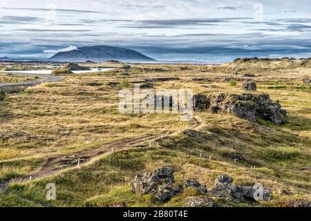 tranquil landscape with solitary lava monoliths at Lake Myvatn in ...
