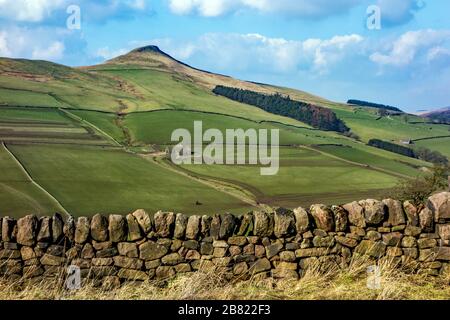 Shutlingsloe hill viewed over dry stone wall near the village of ...