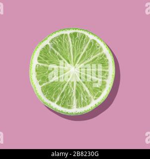 Green lime slices pattern on vibrant yellow color background. Minimal ...