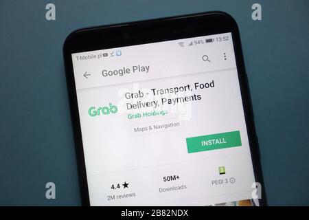 Grab app on Google Play website displayed on smartphone Stock Photo - Alamy