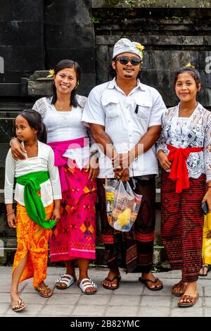 A Balinese Hindu Family Pose For Photos At The Batara Turun Kabeh ...