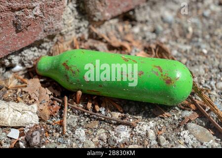 Close-up of miniature cylinder of nitrous oxide, a drug of abuse ...