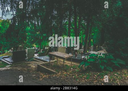 dramatic tombstones in scenic cemetery at colorful autumn Stock Photo ...