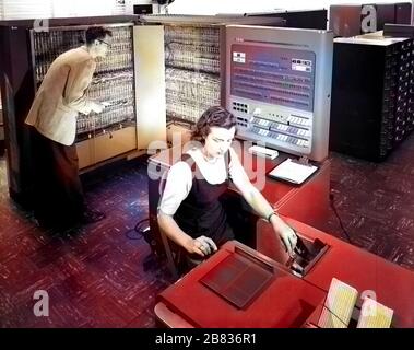 Human computer with IBM 704 in 1959 Stock Photo - Alamy