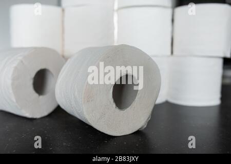 toilet paper bunched up together on a counter in a home Stock Photo - Alamy