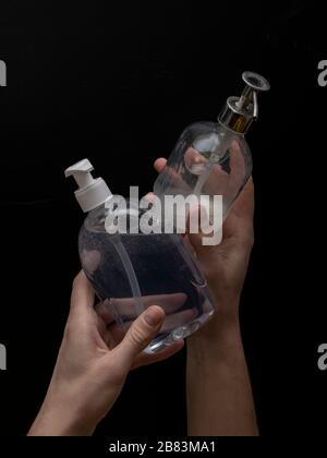 Young man is holding taking giving throwing a soap bottle for washing ...