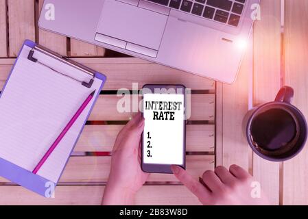Writing note showing Interest Rate. Business concept for percentage of ...