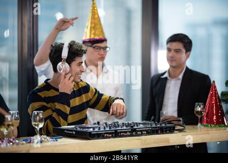 DJ working with Digital Mixer & Controller in celebration party Stock ...