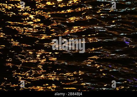 Water surface. Oily sheen of the night waves in lamplight. Oil painting ...