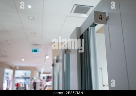 Fitting rooms in the store and number plates Stock Photo - Alamy