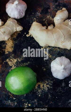 Citrus fruits with garlic and ginger root Stock Photo - Alamy