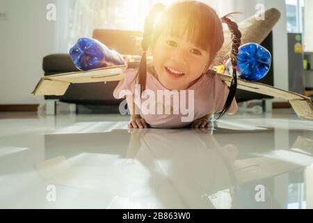 The cute Asian girl learning from internet by laptop with the pink ...